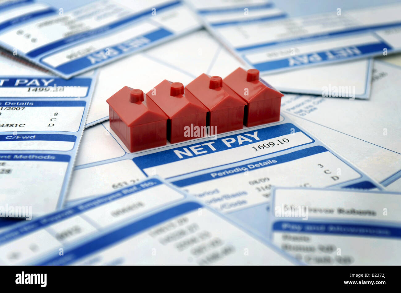 ROW OF MODEL MONOPOLY HOUSES WITH BRITISH PAYSLIPS RE RECESSSION CREDIT ...