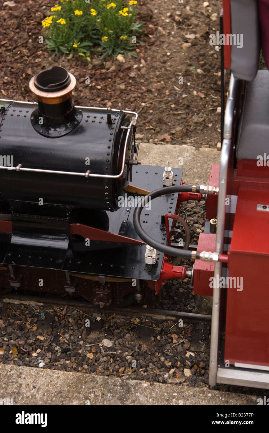 7.25 inch gauge model steam locomotive pushing passenger trolley Stock ...