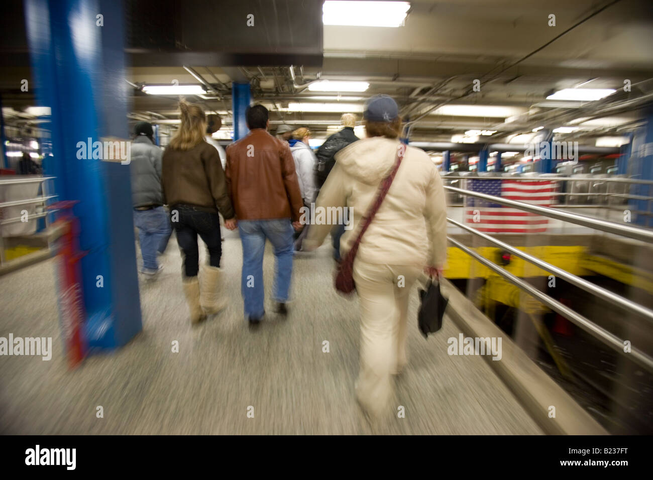 Commuters and passengers walking on a subway platform Stock Photo - Alamy