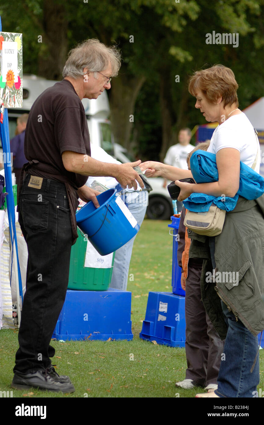 Man collecting money Stock Photo - Alamy