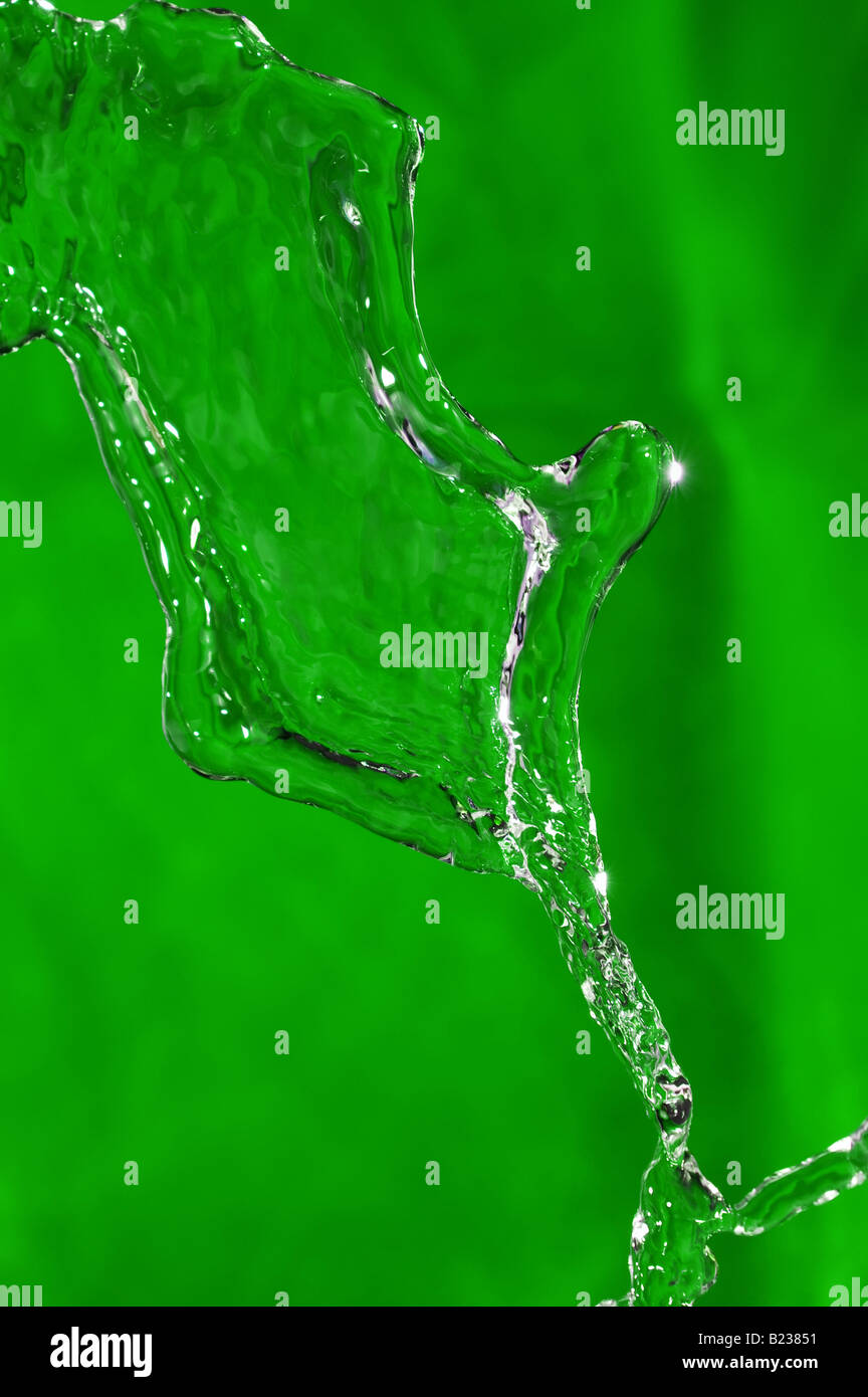 Flowing water stream over colored background Stock Photo - Alamy