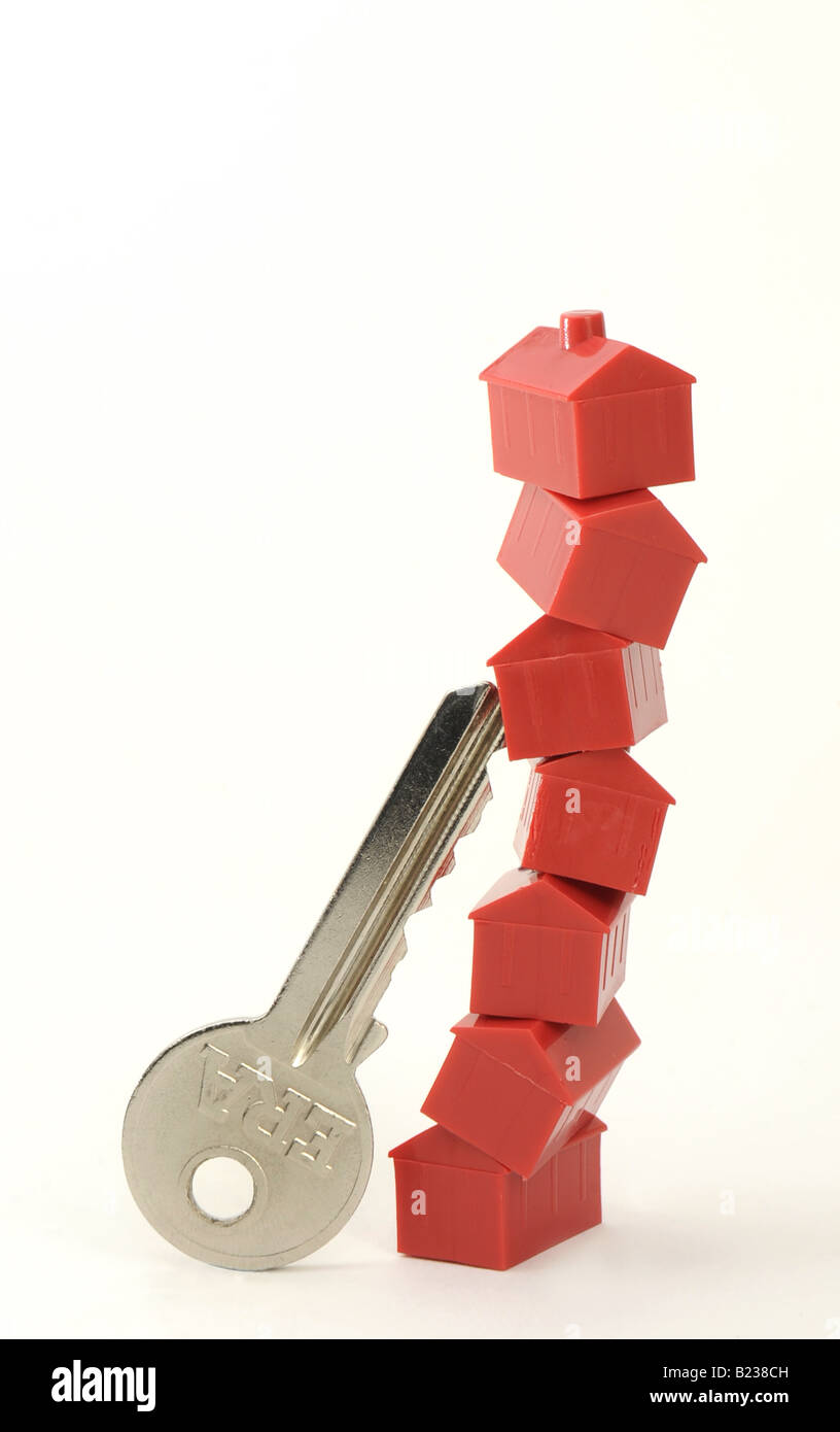 BRITISH HOUSE KEY WITH BALANCING MODEL MONOPOLY HOUSES,UK Stock Photo ...