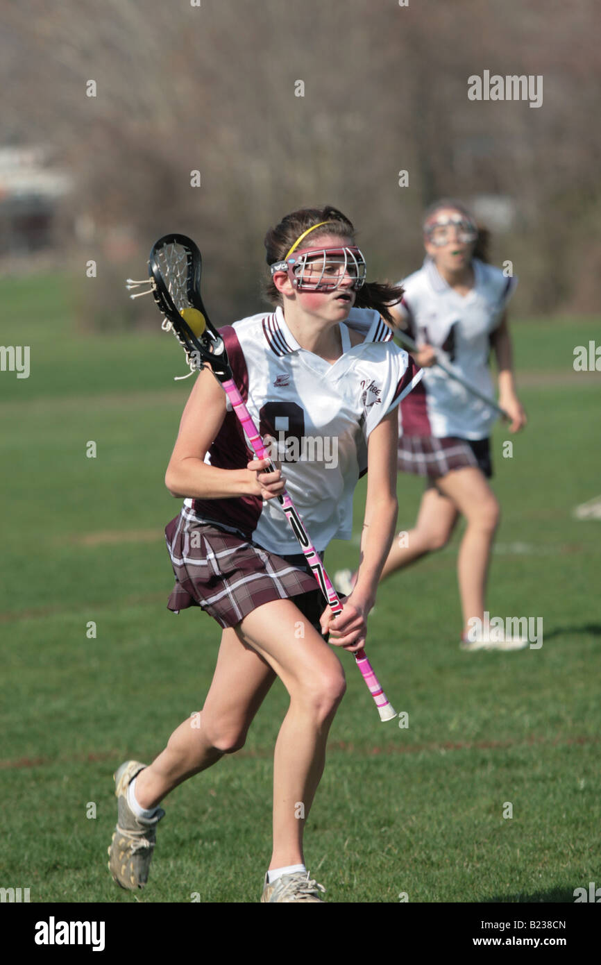 High school girls playing lacrosse Stock Photo - Alamy