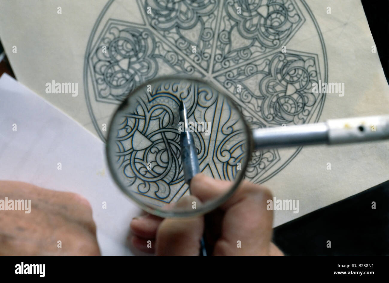 Restoring Quran through a Magnifying Glass Stock Photo - Alamy