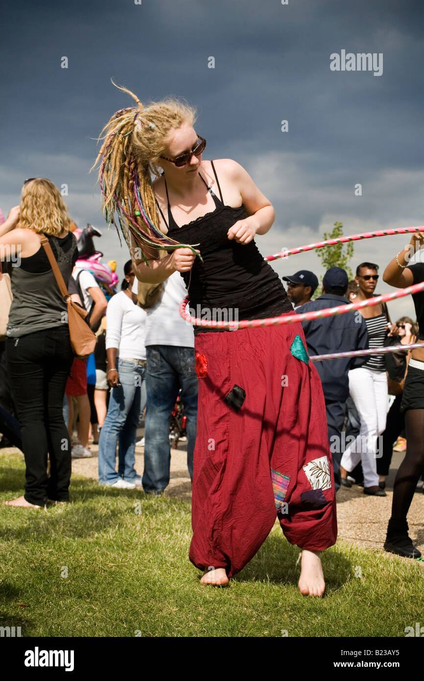 Young woman playing with Hula Hoop at Rise festival Finsbury park ...