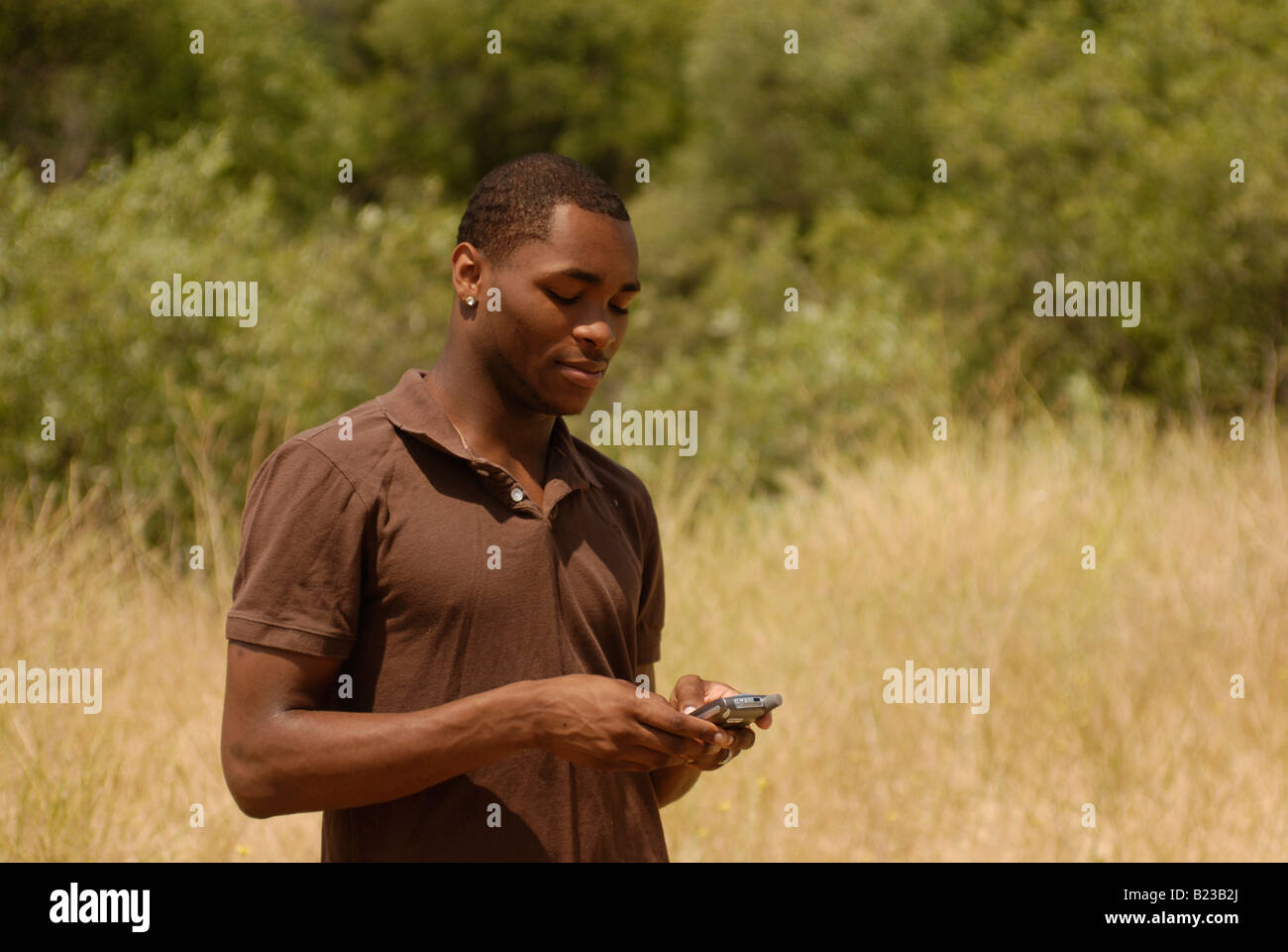 man using cell phone Stock Photo - Alamy