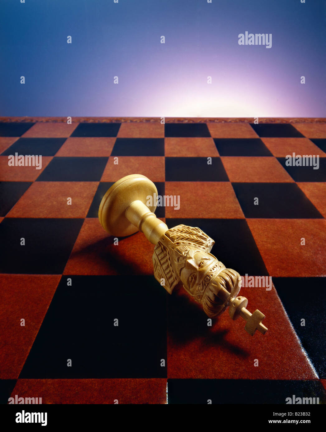 checkmate of fallen king on chessboard Stock Photo - Alamy