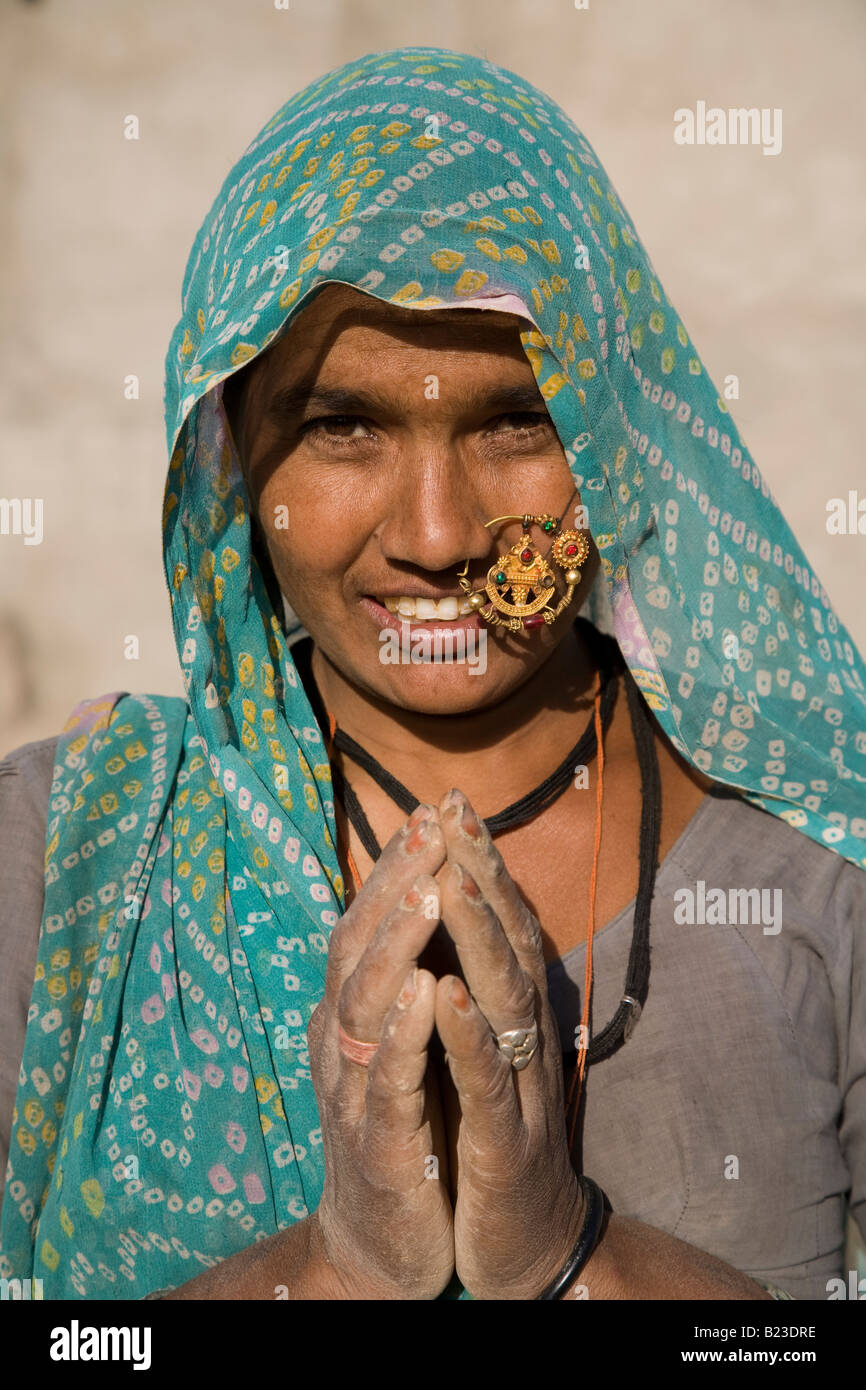 Veiled Indian woman with hands together and nose ring jewellery Stock ...