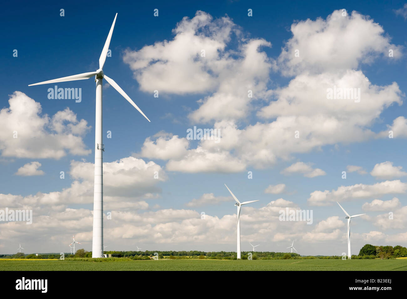 Big wind turbines in front of blue sky Stock Photo - Alamy