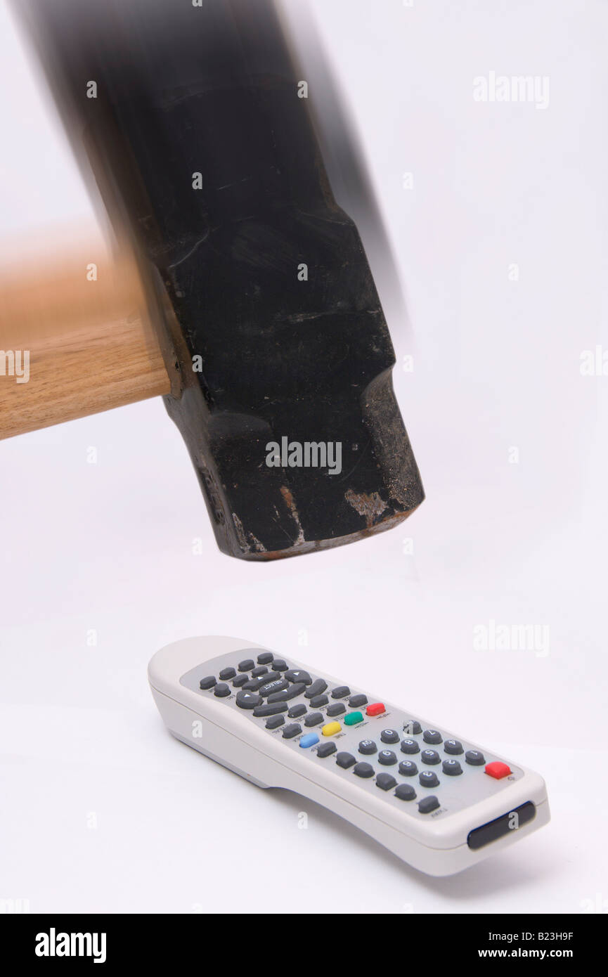 Remote control and hammer March 2008 Stock Photo - Alamy