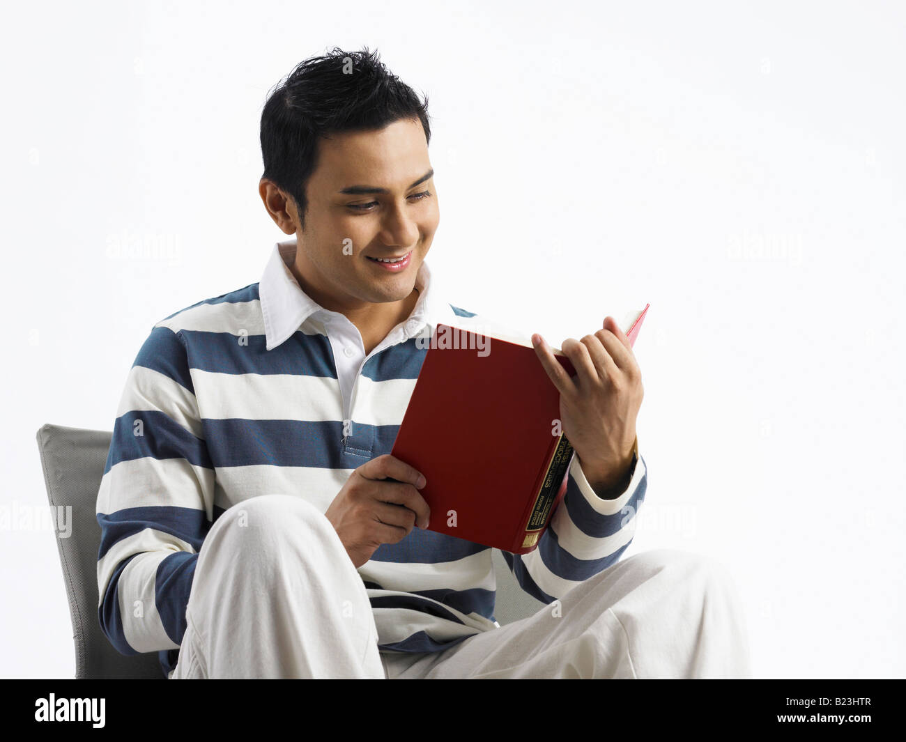 man reading a book Stock Photo - Alamy