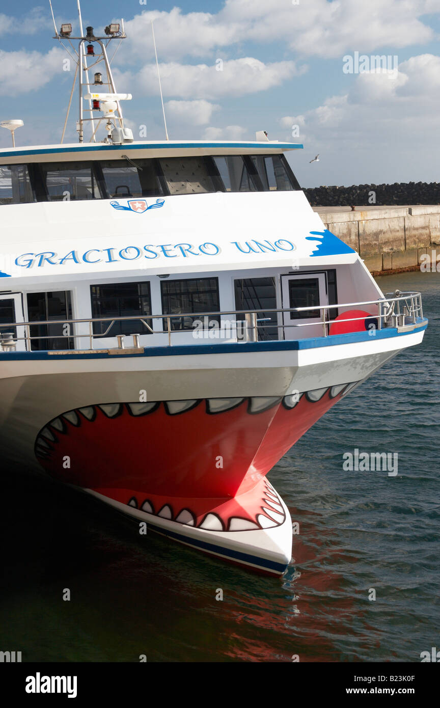 Small ferry with shark's teeth painted on the bow on La Graciosa island ...