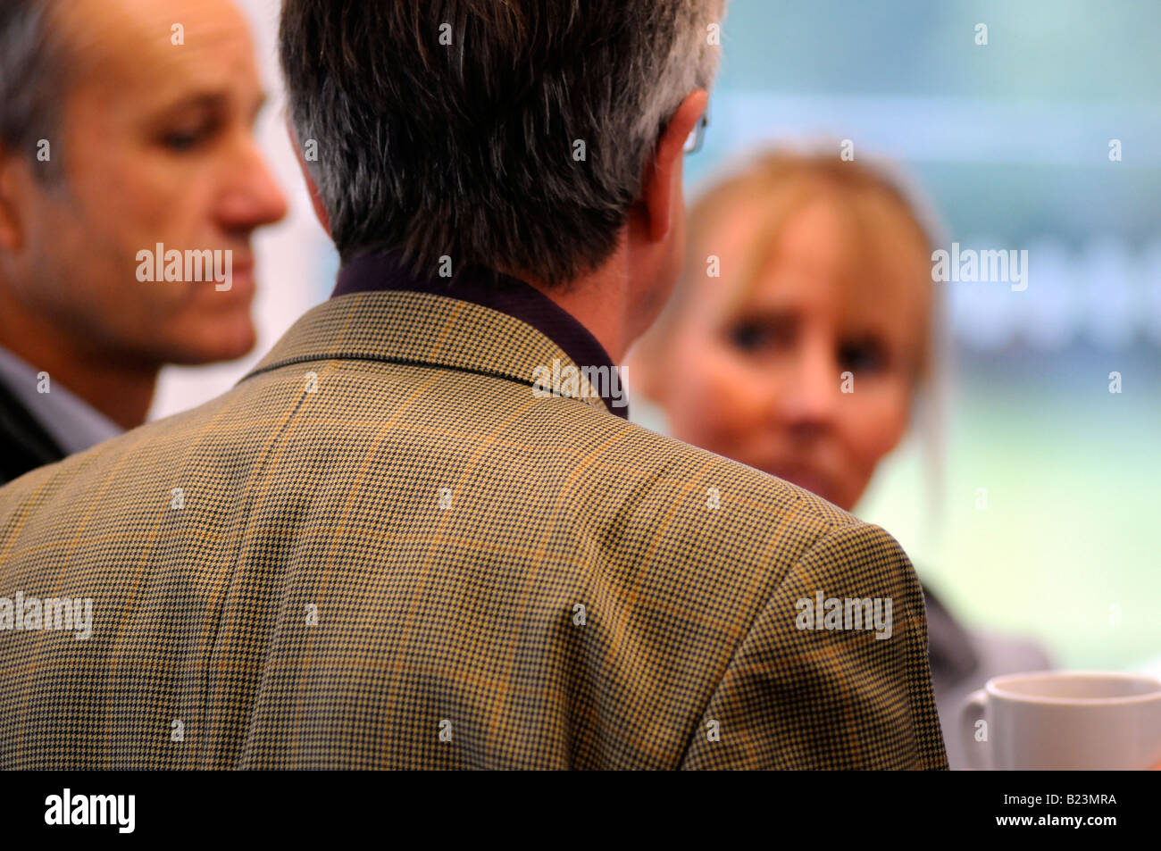Royalty free photograph of a British business men in meeting talking in ...