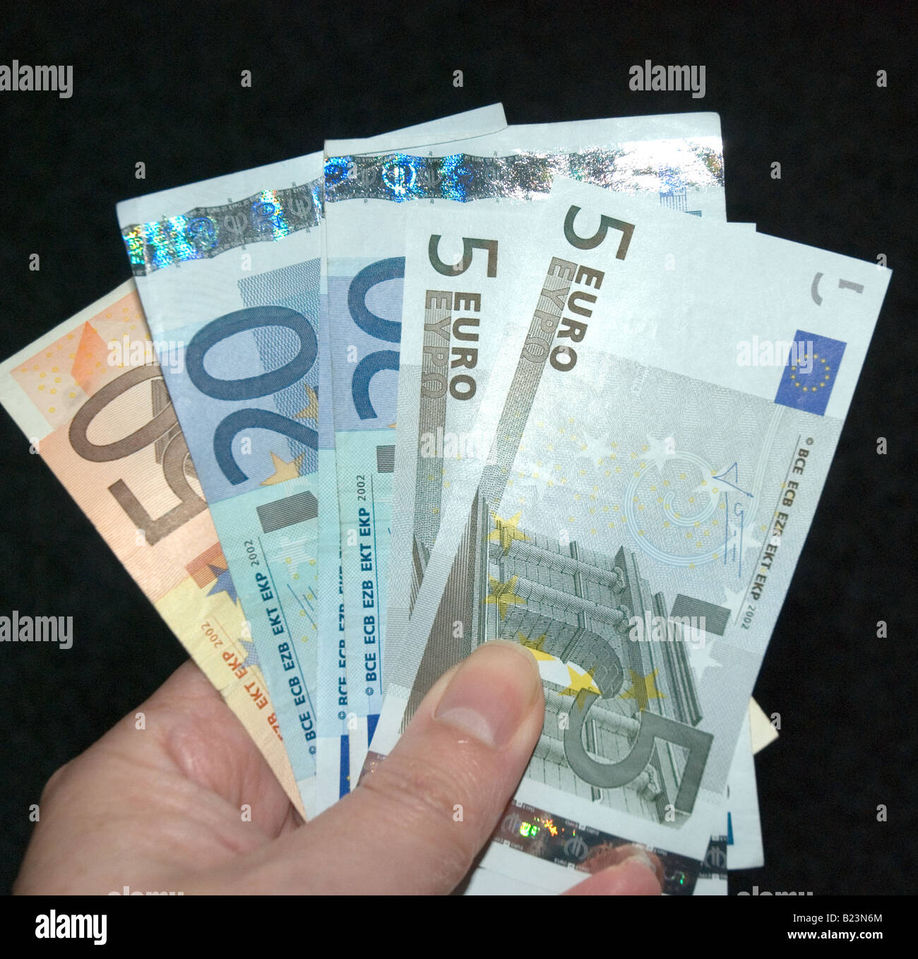 Collection of Euro Bank Notes held vertically Stock Photo - Alamy