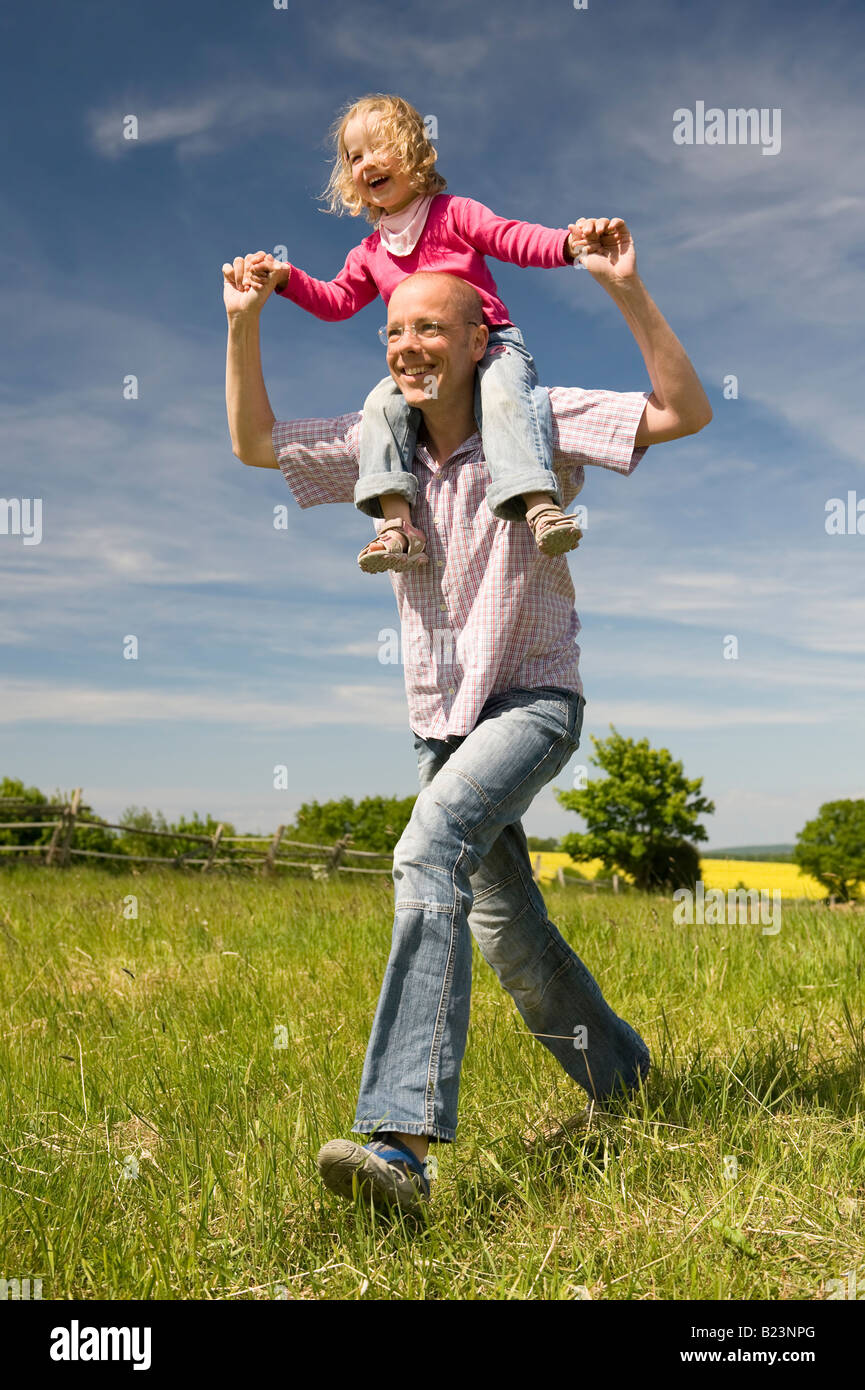 Young father with his daughter running fast Stock Photo - Alamy