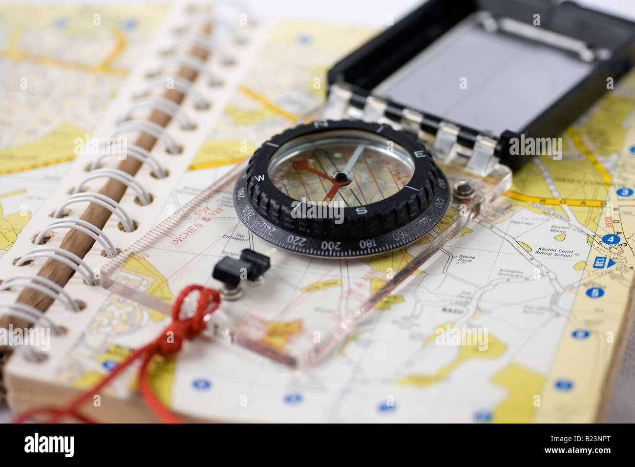 A compass and a map Stock Photo - Alamy