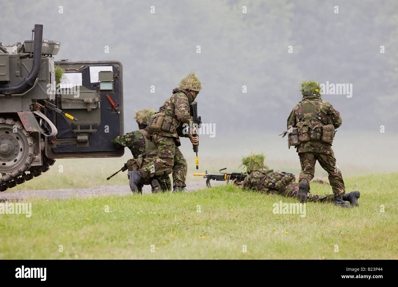 British troops exit the rear of a Bulldog armoured personnel carrier ...