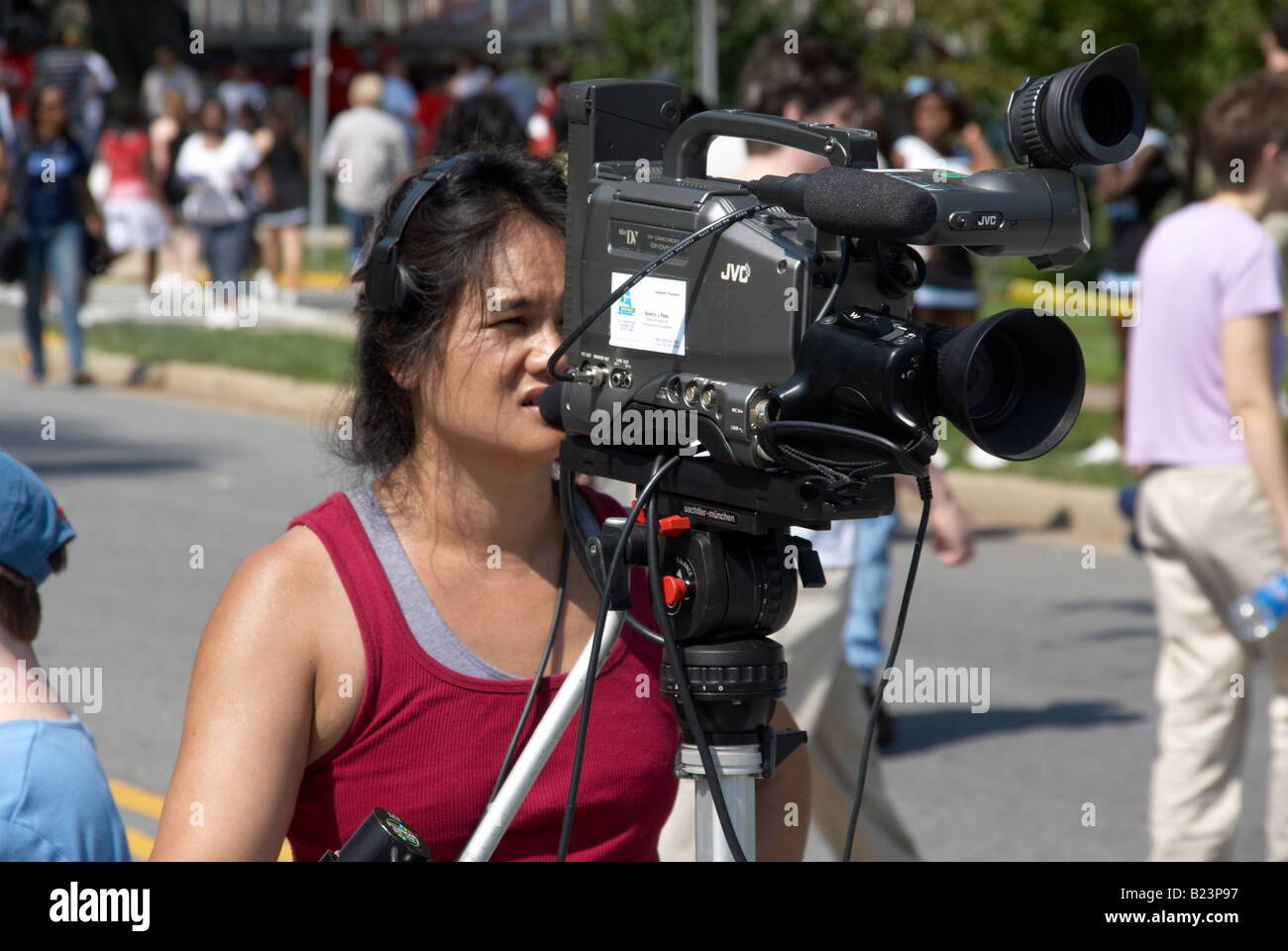 a TV camerawoman Stock Photo - Alamy