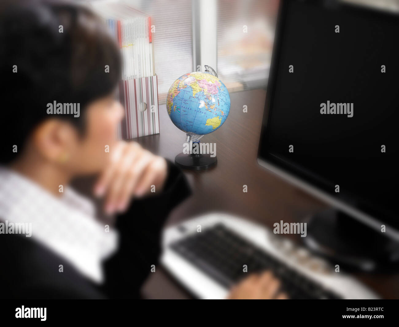 Businesswoman using computer desktop Stock Photo - Alamy
