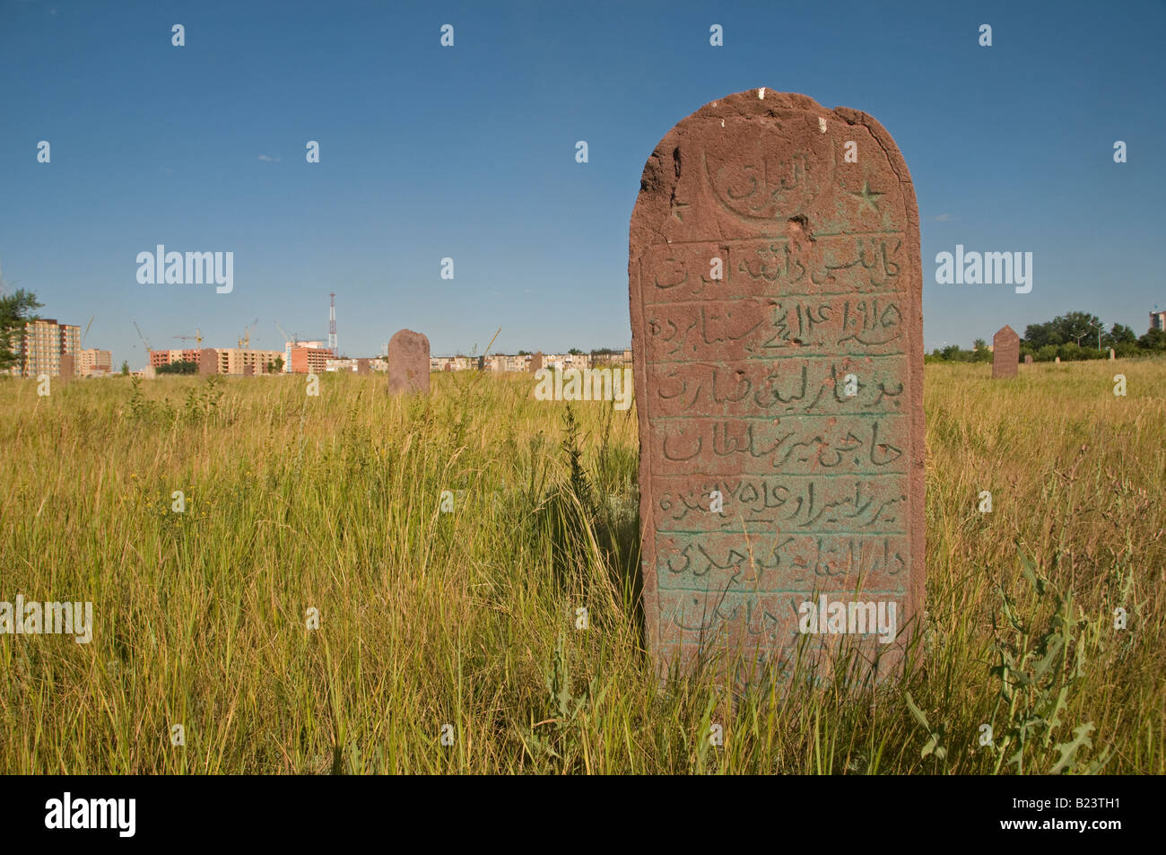 Old tombstone with Arabic writing in “Karaotkel” Muslim cemetery in Nur ...