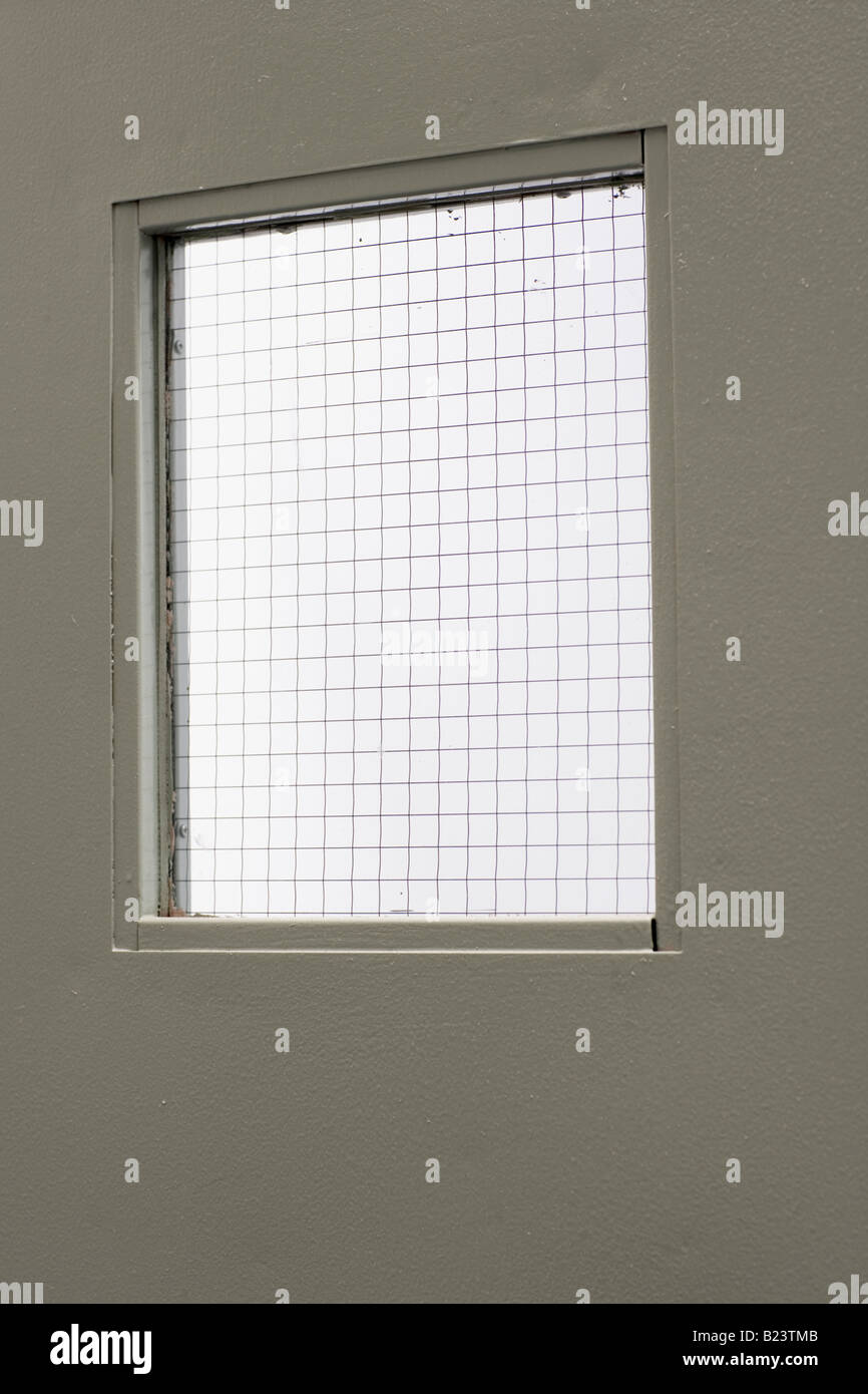 Metal Door with Mesh Window Stock Photo - Alamy