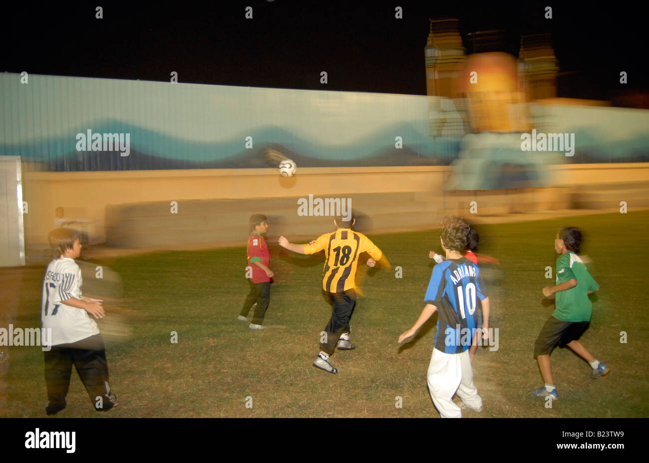 Saudi school children playing football on an artifical pitch in the ...