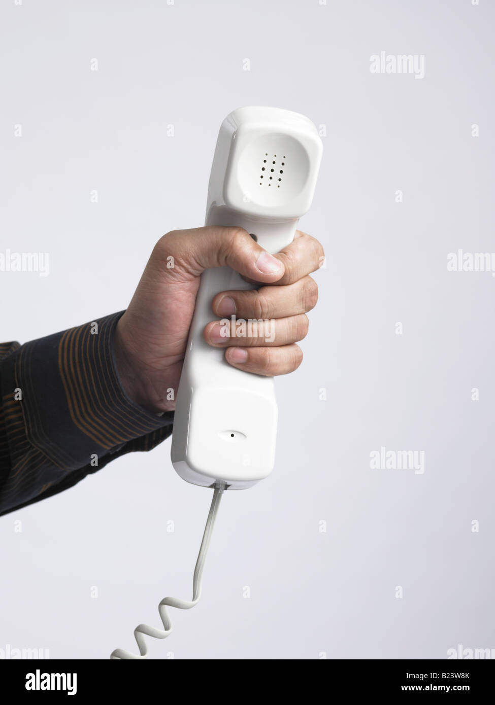 Human hand holding telephone cord hi-res stock photography and images ...