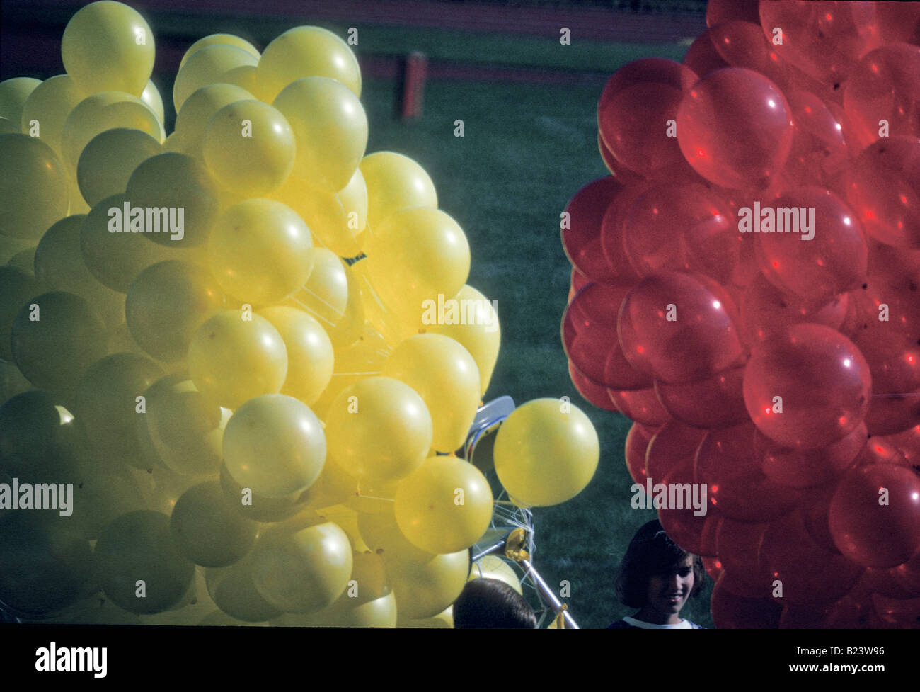 Large assortment red yellow balloons at street parade Stock Photo - Alamy