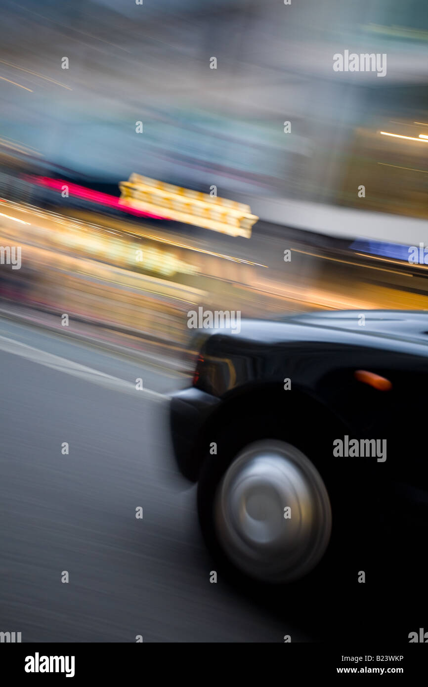 A fast paced taxi negotiates the London streets Stock Photo - Alamy