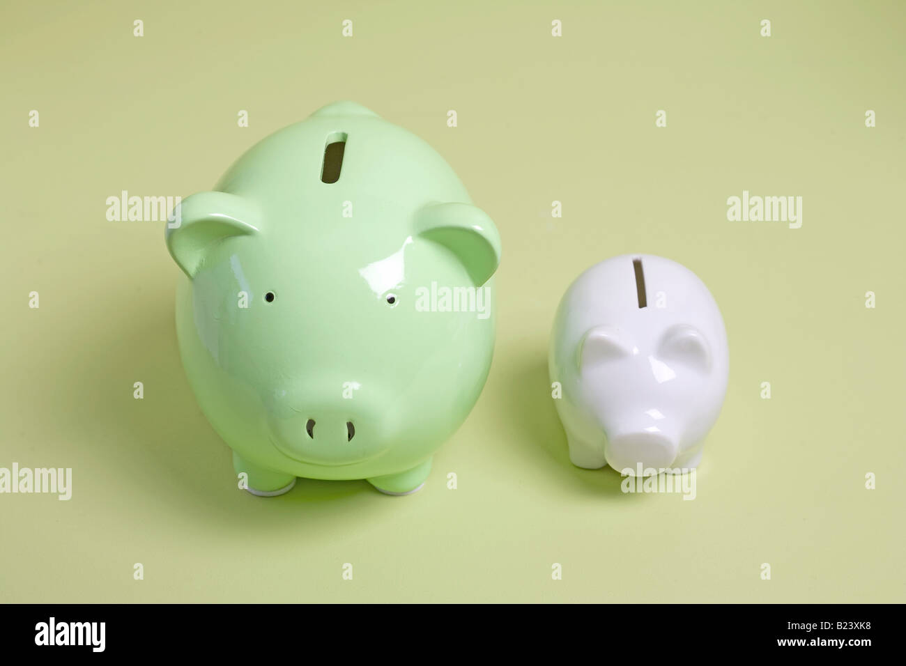 two piggy banks, one large and one small Stock Photo - Alamy