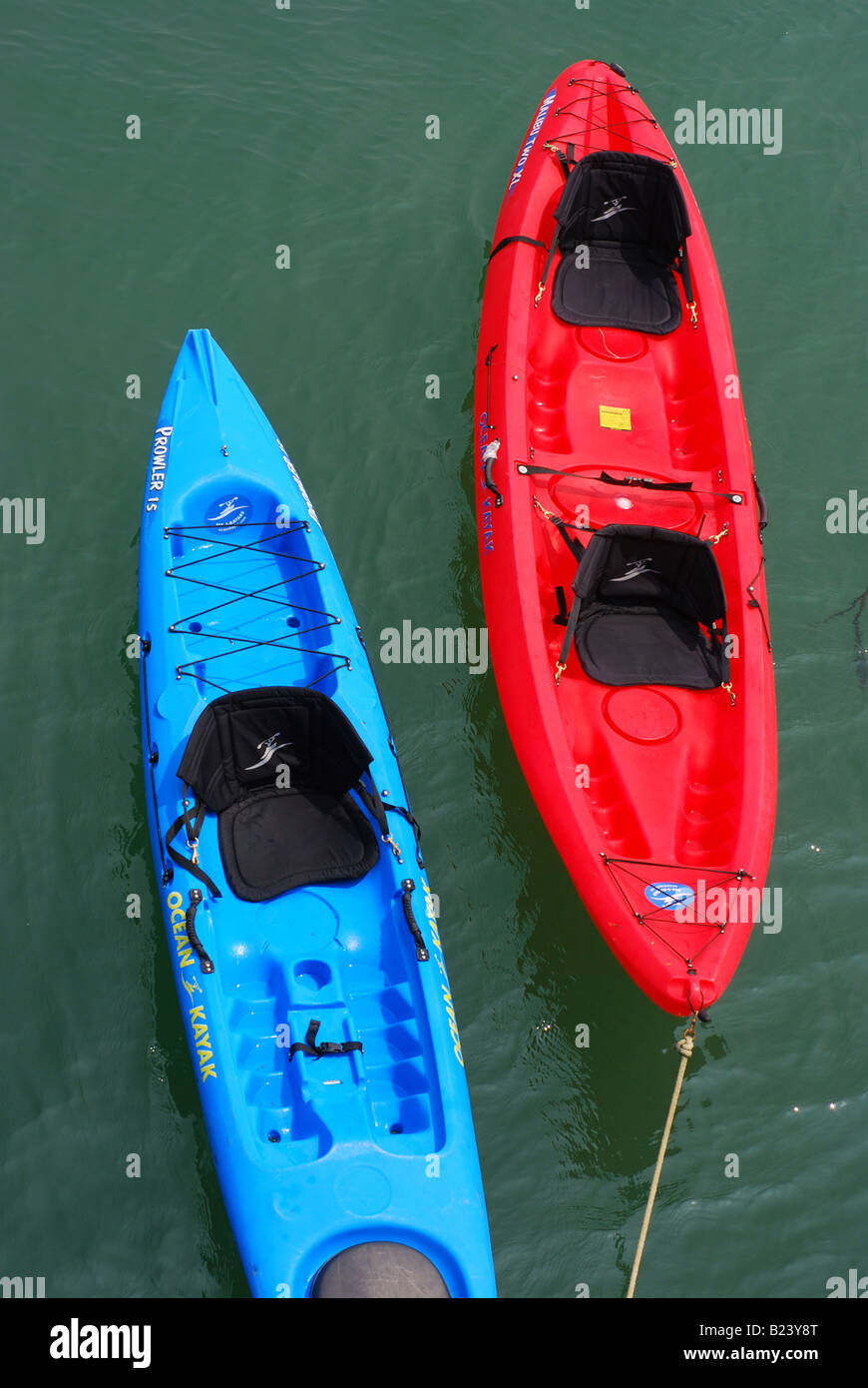 Two sea kayaks docked in the ocean Stock Photo - Alamy