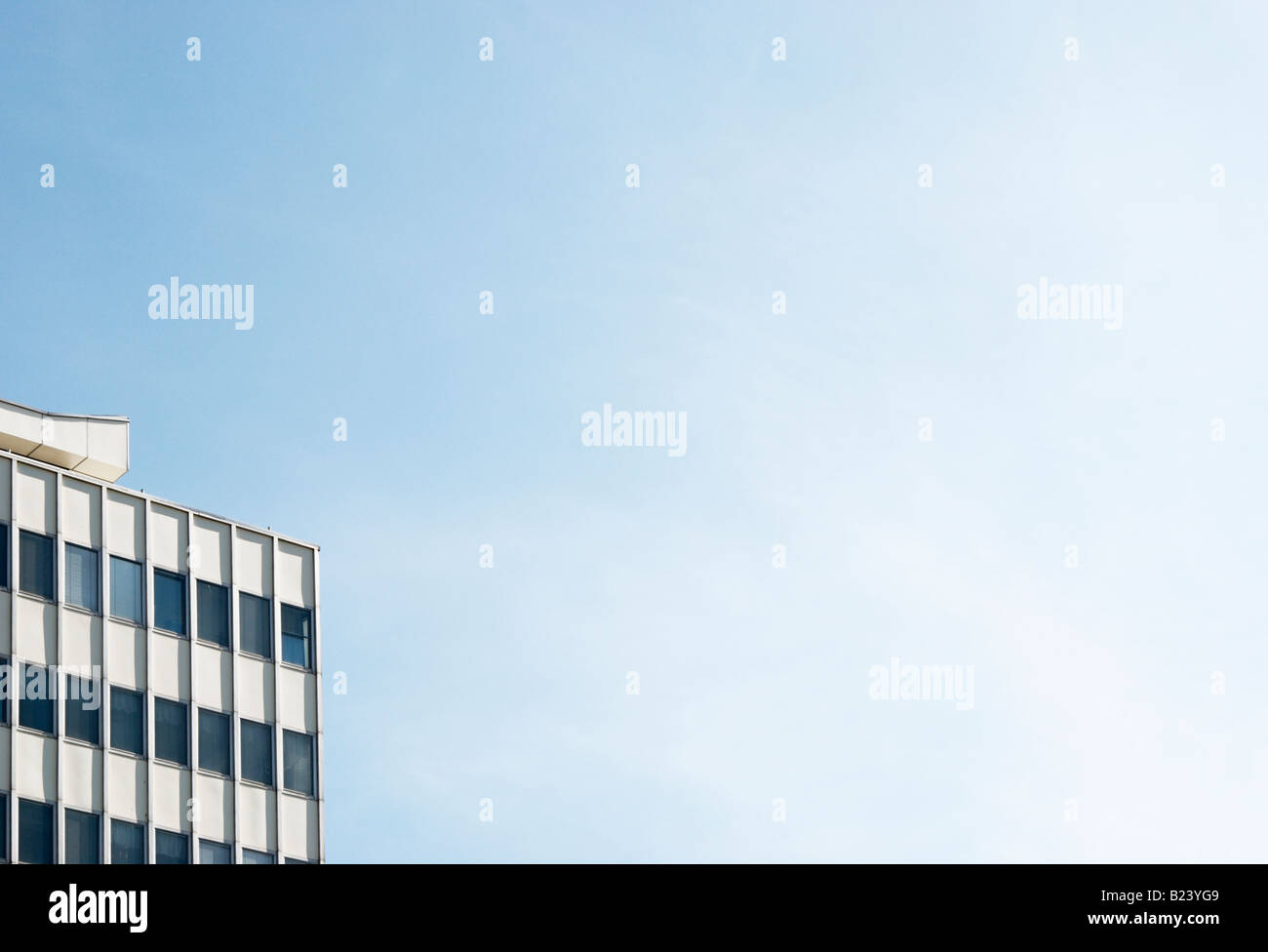 Office building and blue sky Stock Photo - Alamy