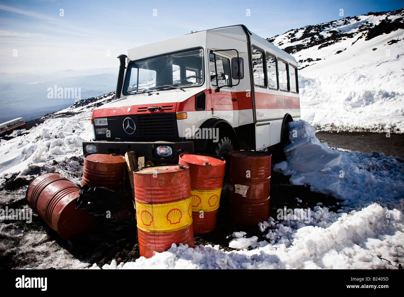 Gasoline barrels near a Mercedes shuttle bus on Mount Etna, Sicily ...