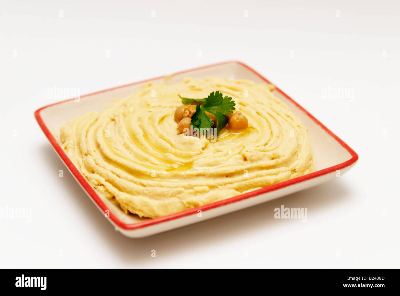 Hummus, arabic food made from cooked and mashed chickpeas, tahini ...