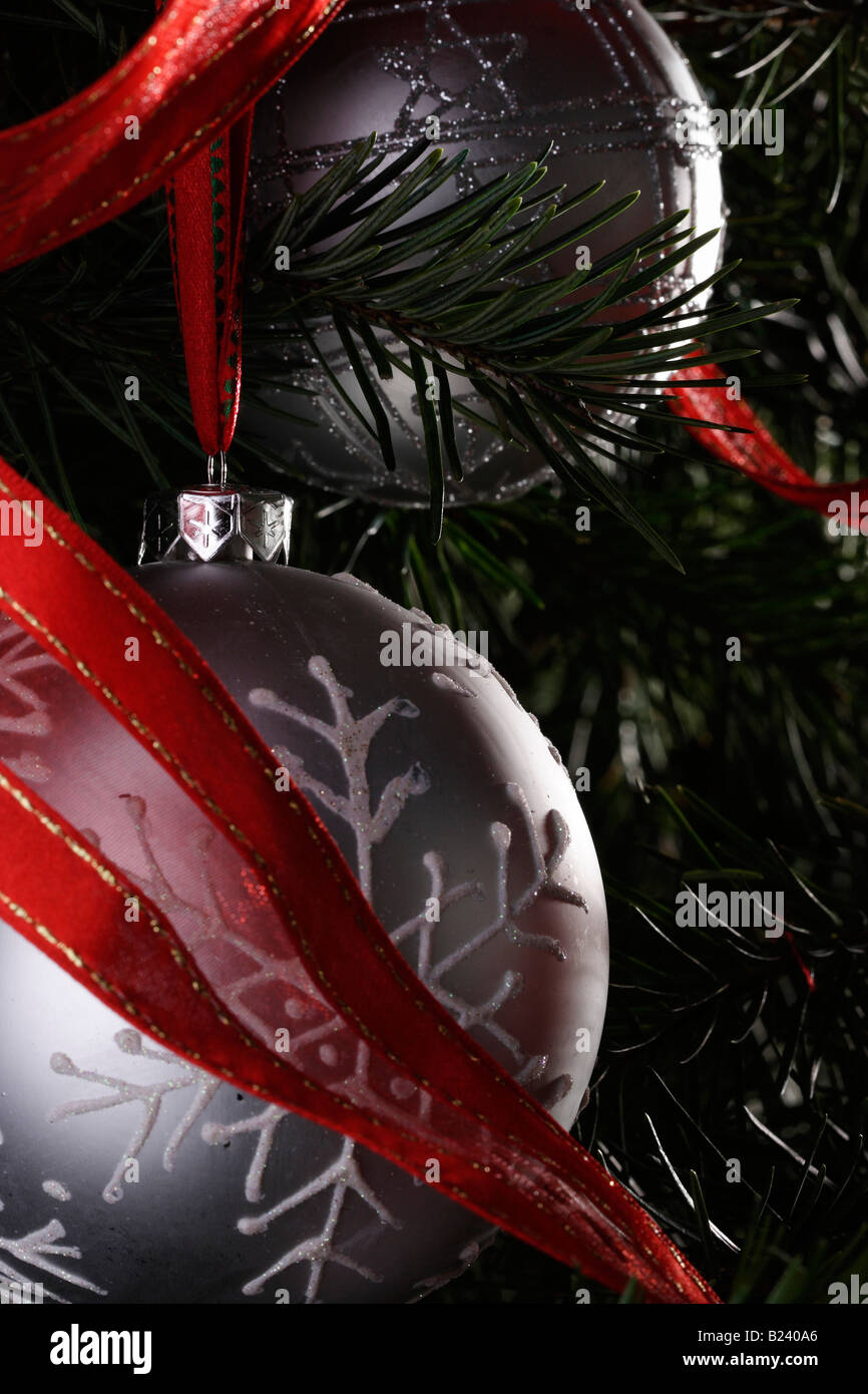Christmas tree with two silver balls ornaments close up front view ...