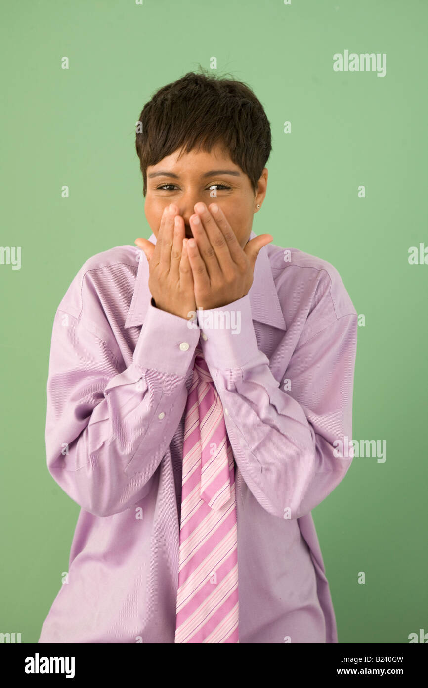 woman laughing in man's clothes looking embarrassed Stock Photo - Alamy