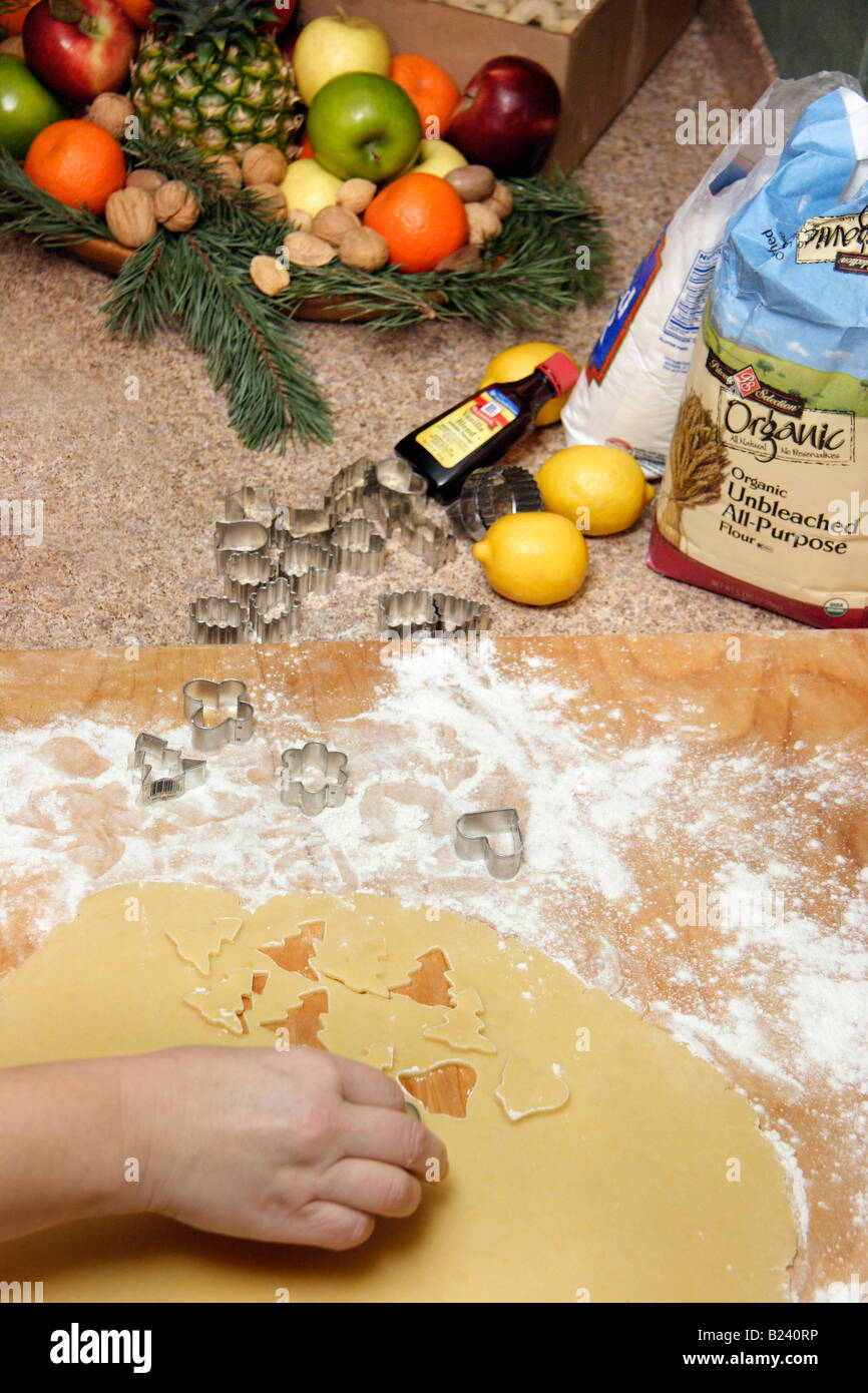 Culinary background with Christmas baking cookies from the dough ...