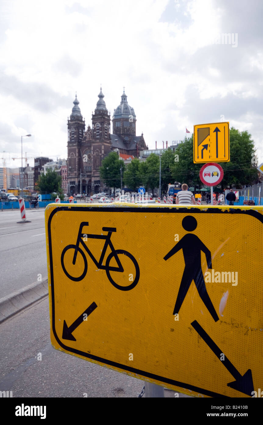 sign showing bicycle walking path division with church of st nicholas ...