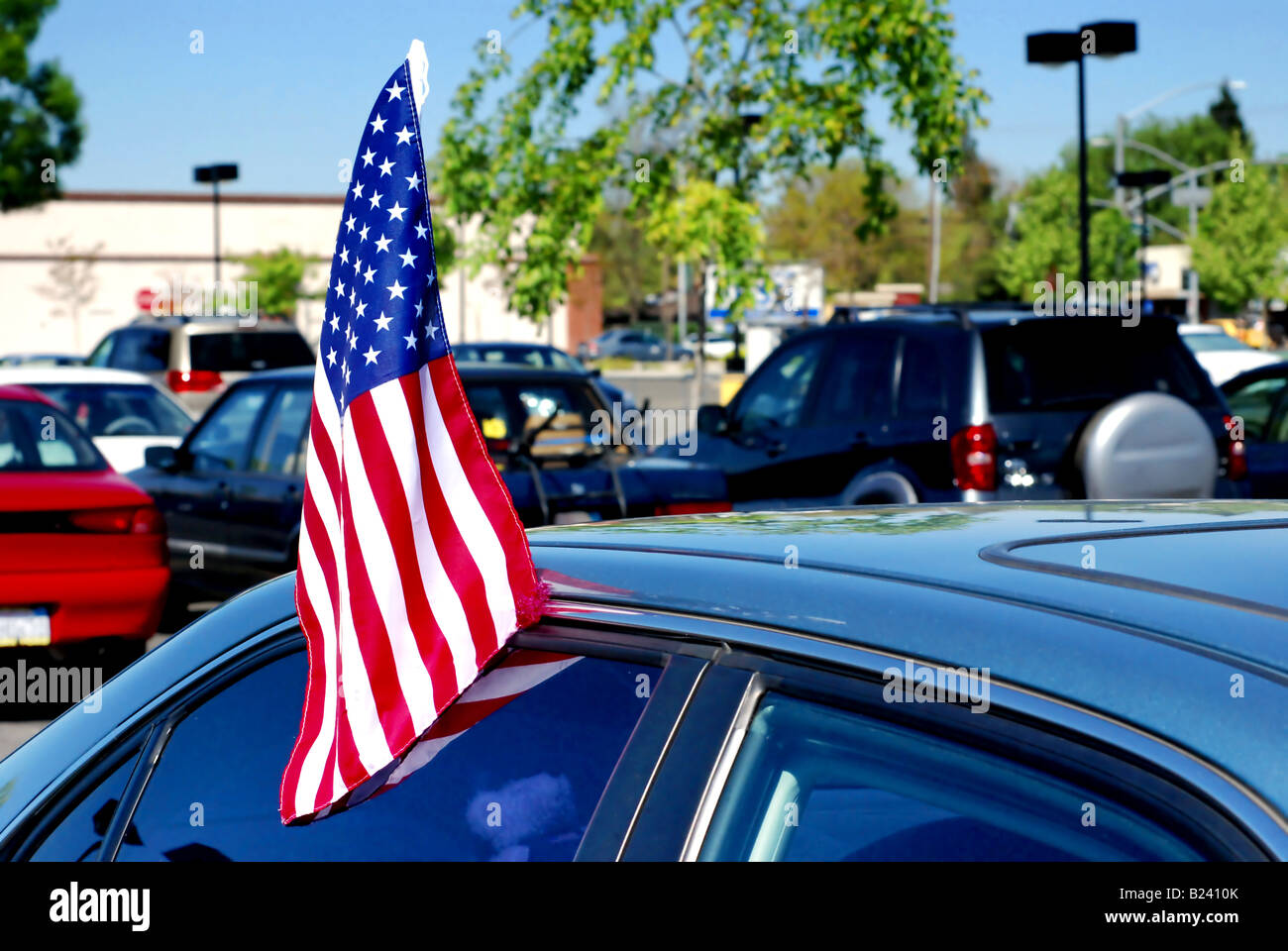 An American flag inserted into a car window Stock Photo - Alamy