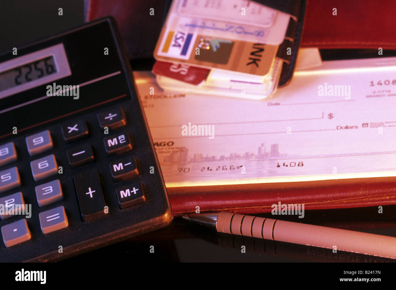 Calculator Checkbook pen wallet personal finance Stock Photo - Alamy