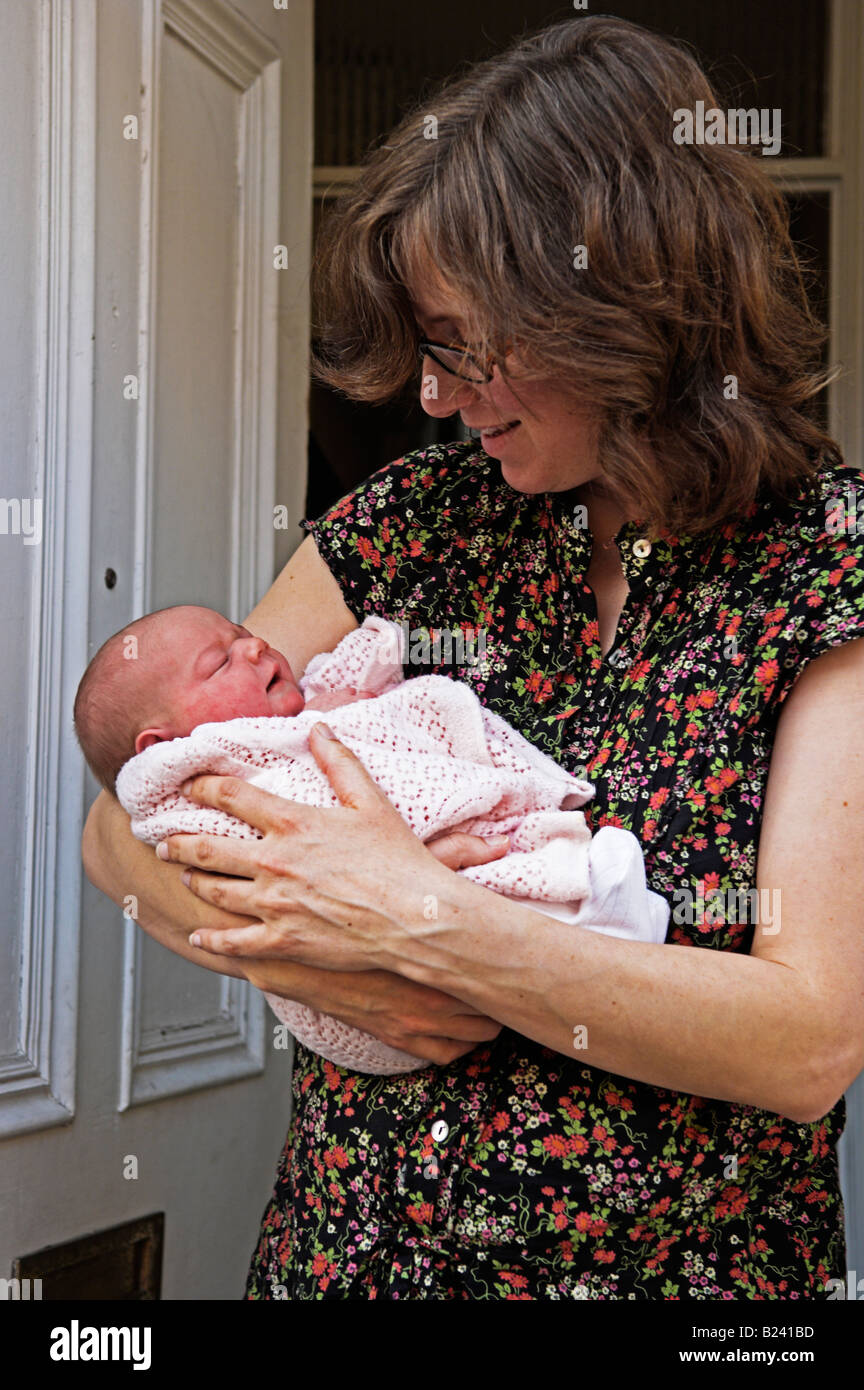 Mother holding baby close hi-res stock photography and images - Alamy