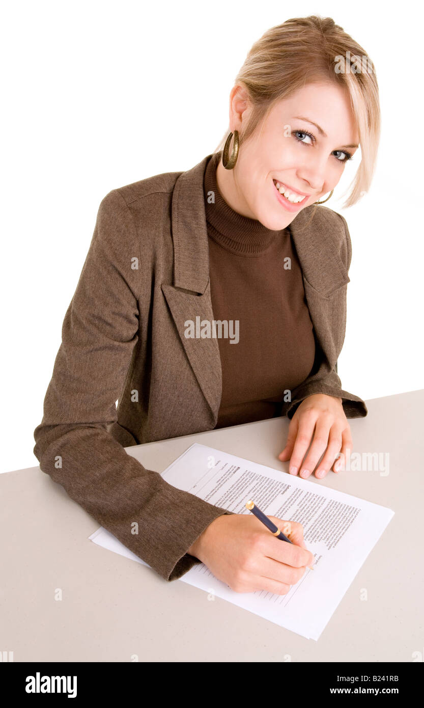 A beautiful young woman is signing a document Stock Photo - Alamy