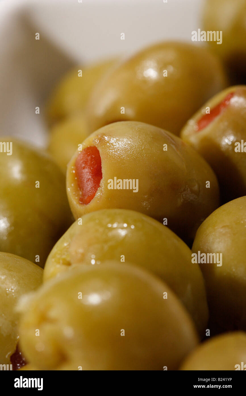 Whole green olives overhead from above blurry blurred background close ...