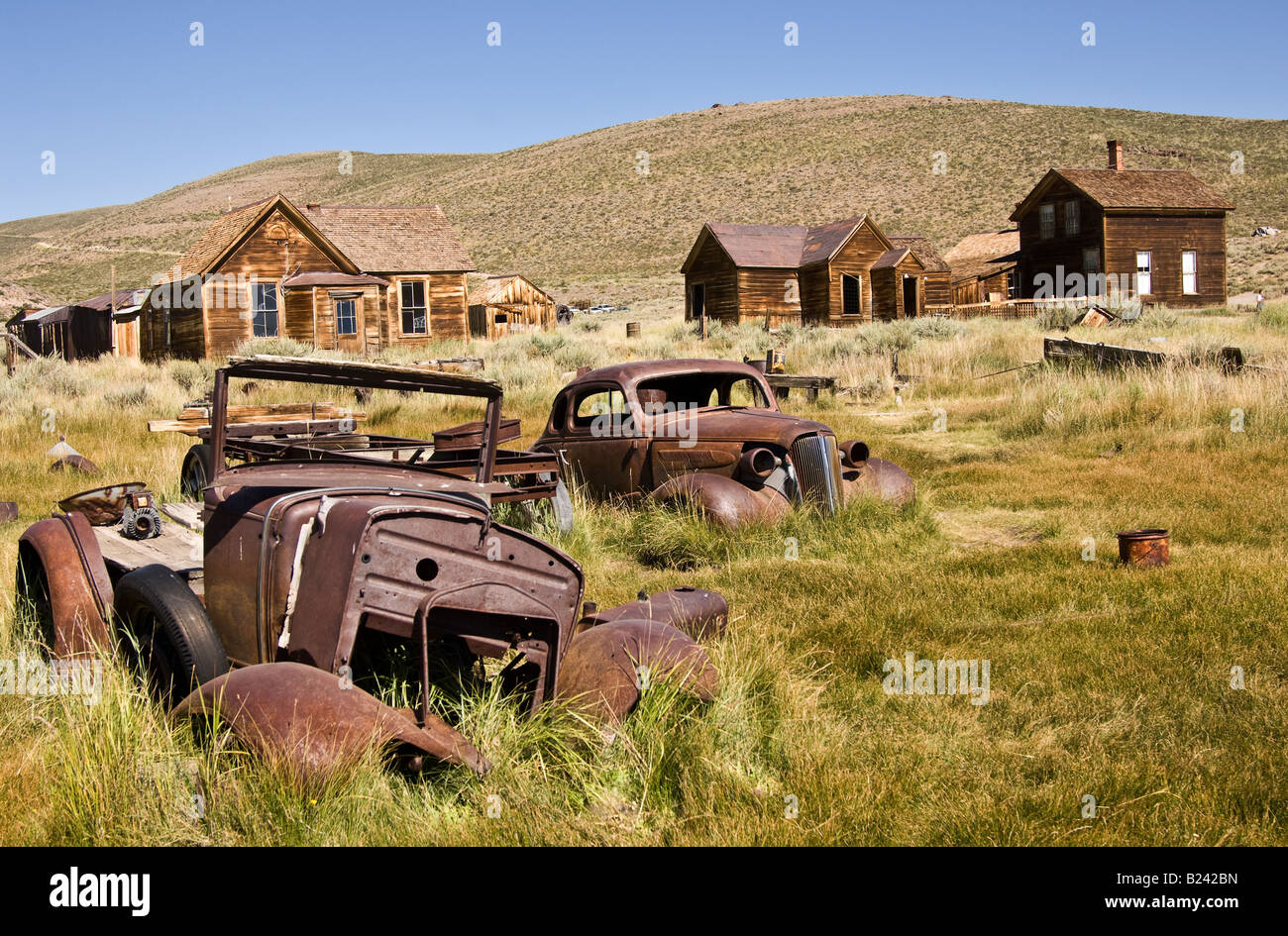 Rusted Cars in a Ghost Town Stock Photo - Alamy