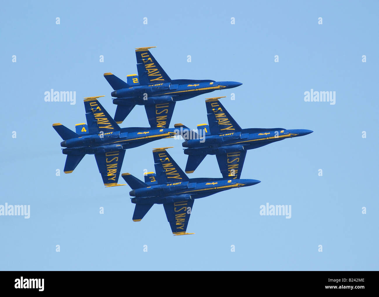 Four Blue Angels planes flying in a tight diamond formation Stock Photo ...