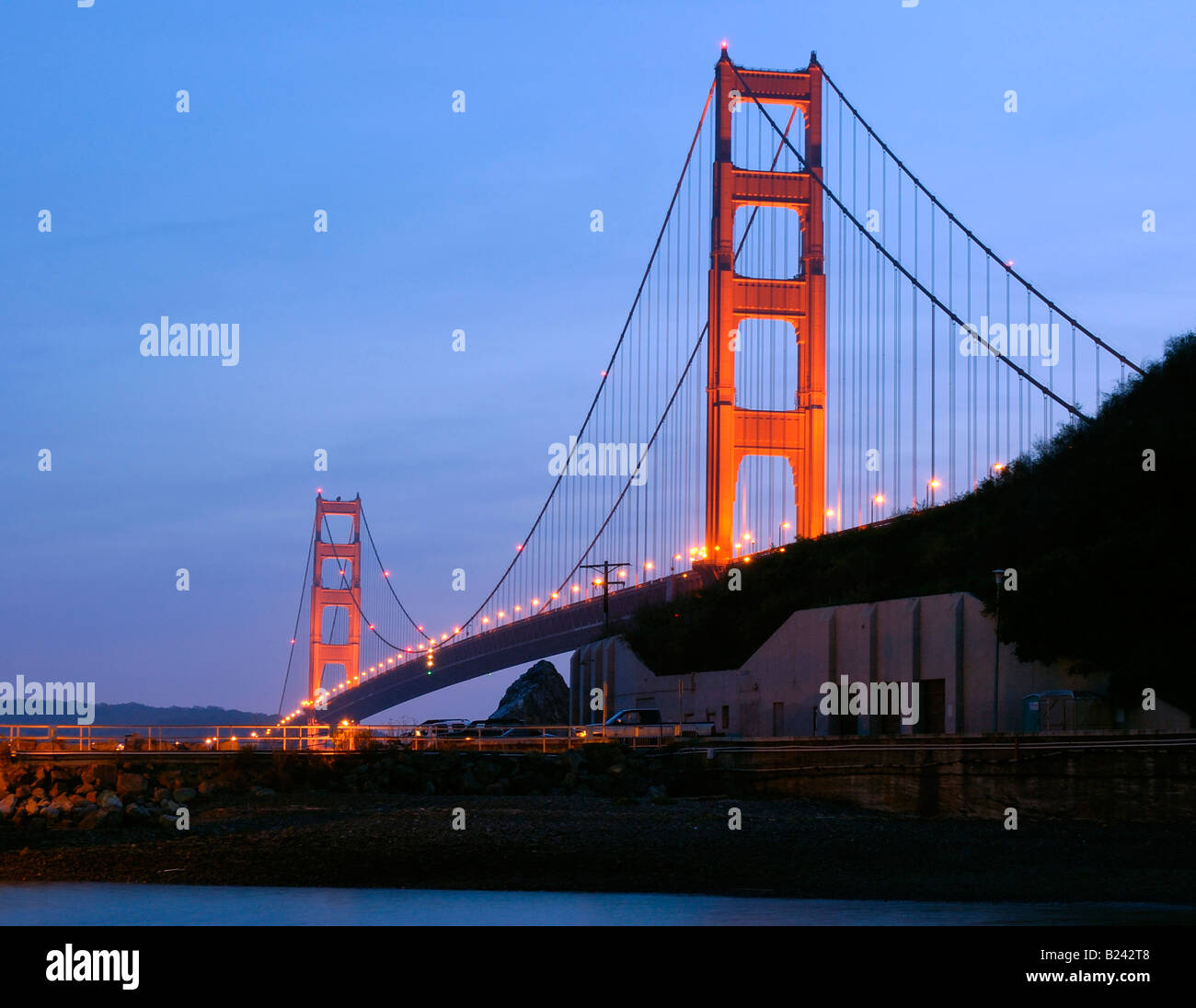 A view of Golden Gate Bridge at dusk from the harbor at Fort Baker ...