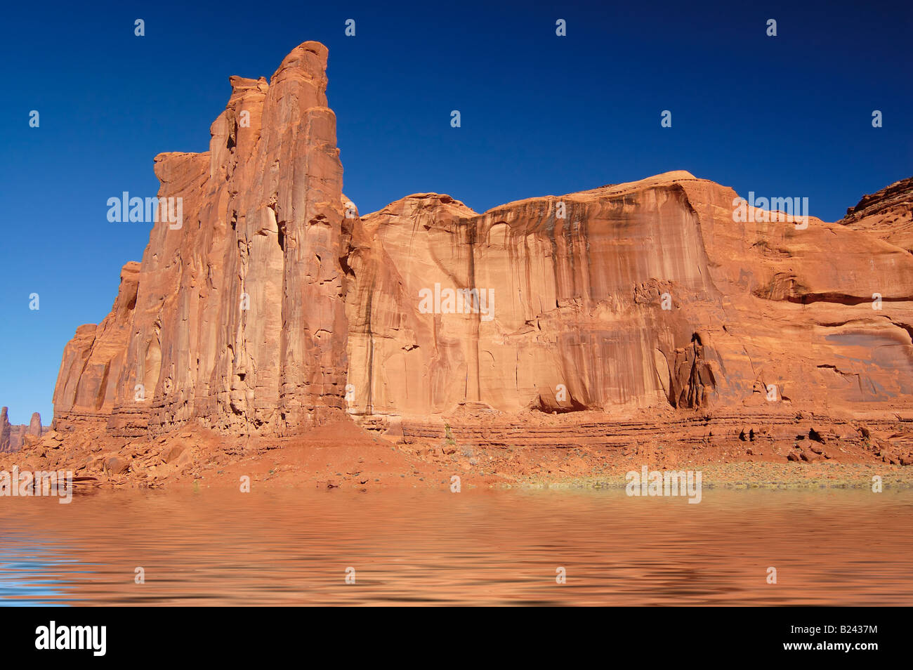 Fantastic background of red cliffs under deep blue sky reflected in ...