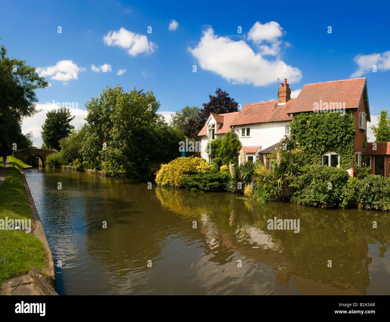 Houses next to canal or river Stock Photo - Alamy