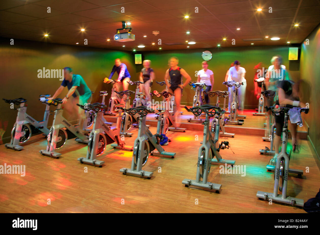 People on Spinning Cycles blurred for speed and power effects in a ...