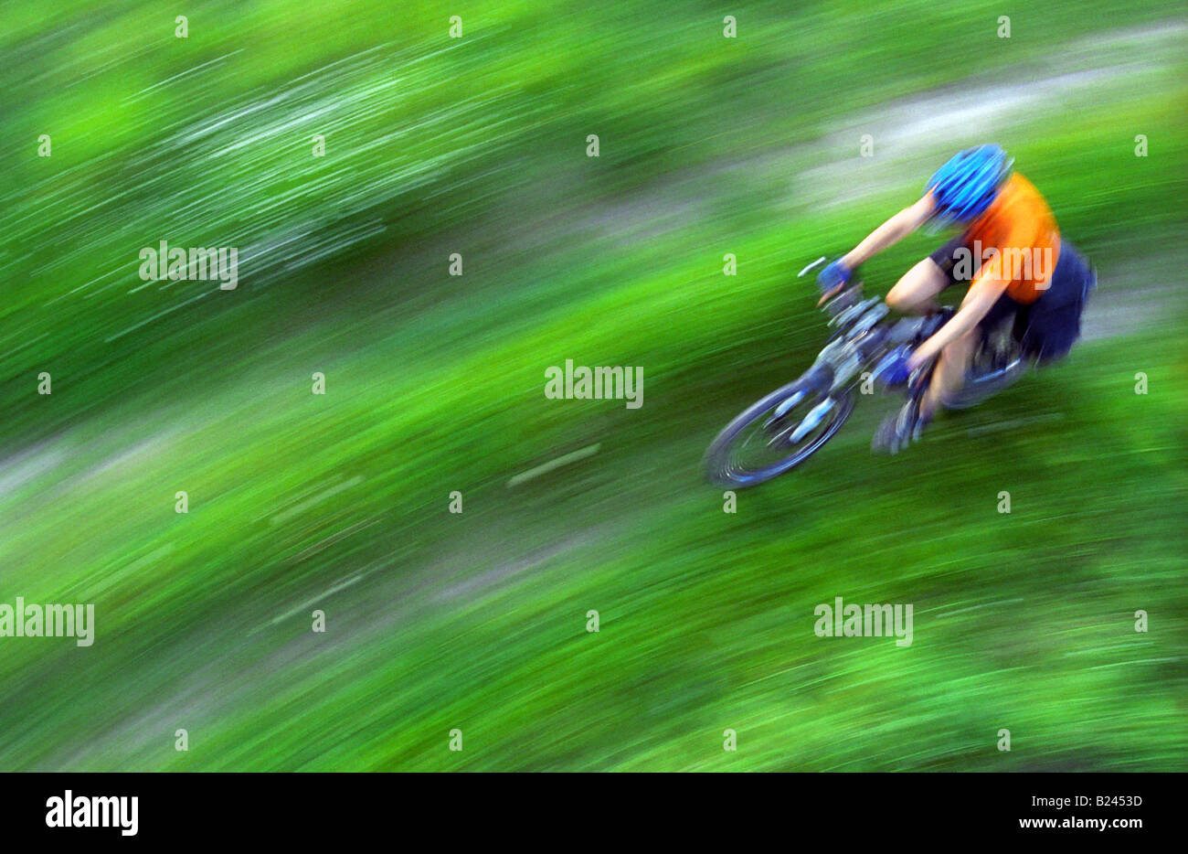 Fast biker cyclist Stock Photo - Alamy